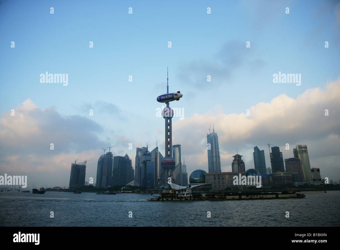 The modern Shanghai,flying blimp and container ship seen from the Bund ...