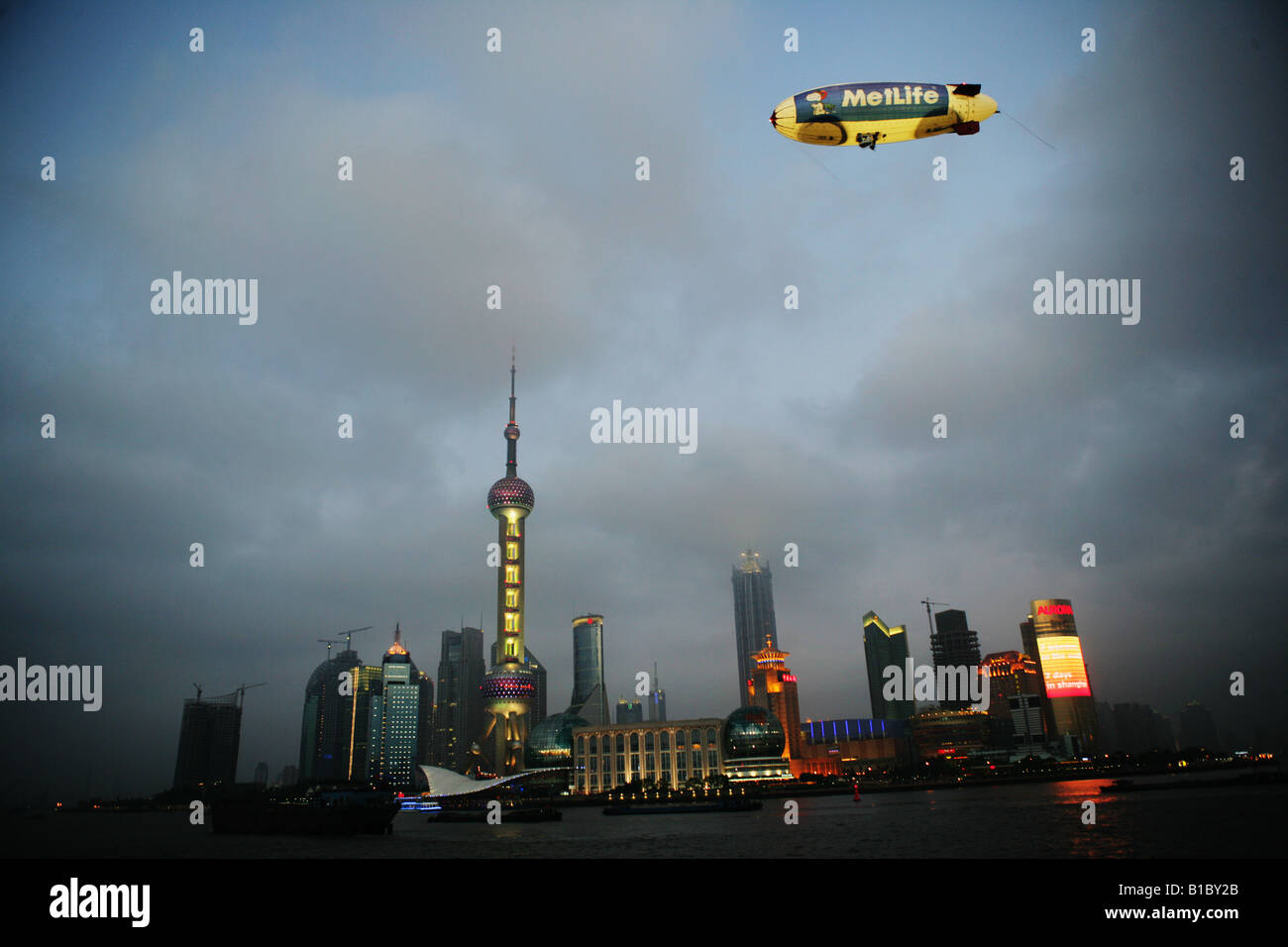 The modern Shanghai and a flying blimp seen from the Bund,Shanghai ...