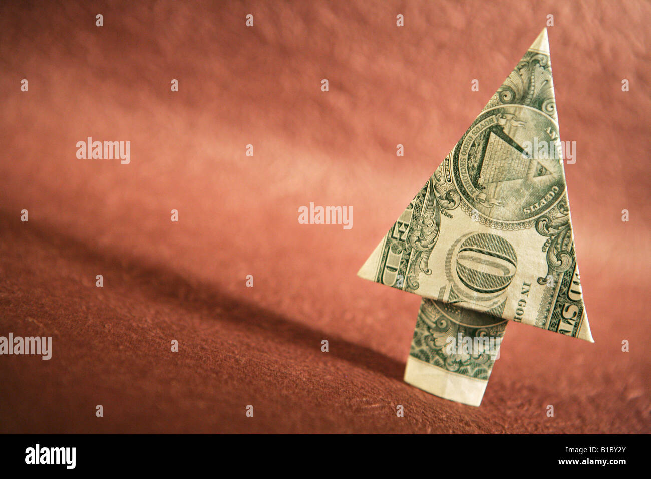 US paper currency folded as an arrow sign Stock Photo - Alamy