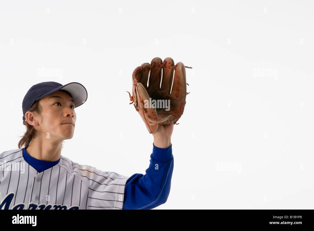 Baseball player trying to catch a ball Stock Photo - Alamy