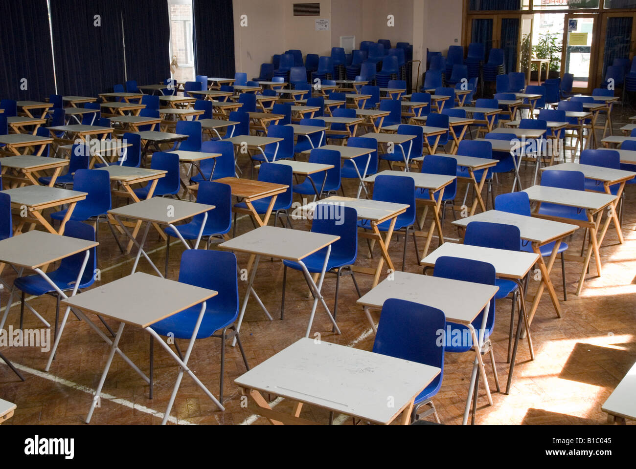An exam hall with tables set ready Stock Photo - Alamy