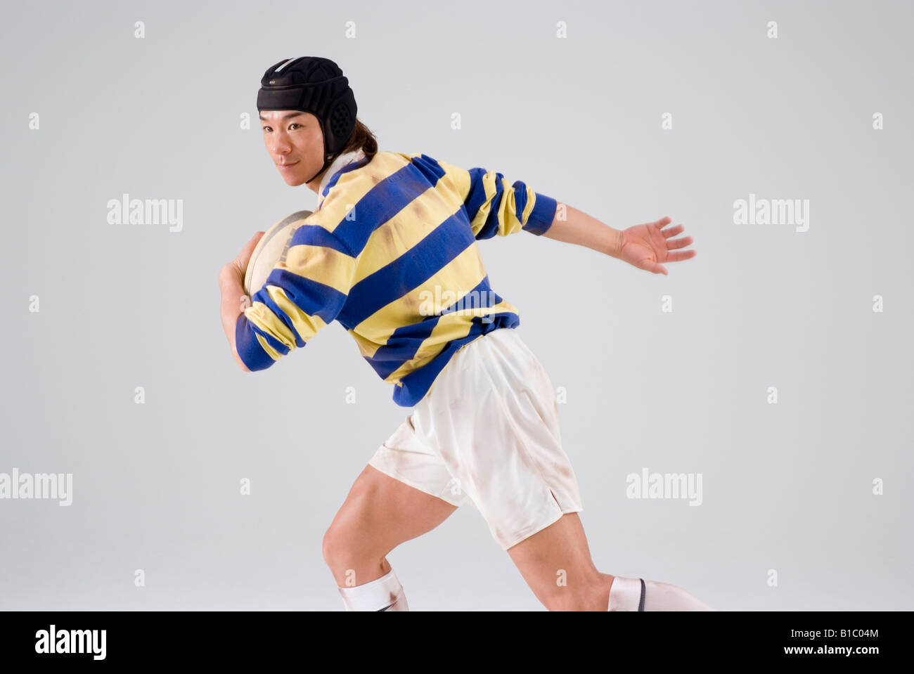 Rugby player running Stock Photo - Alamy