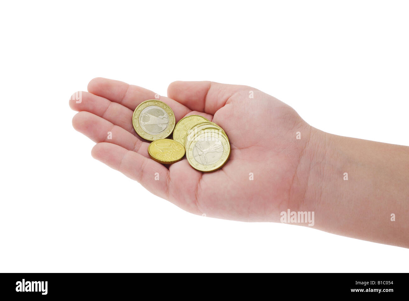 Coins in child's hand on white background Stock Photo - Alamy