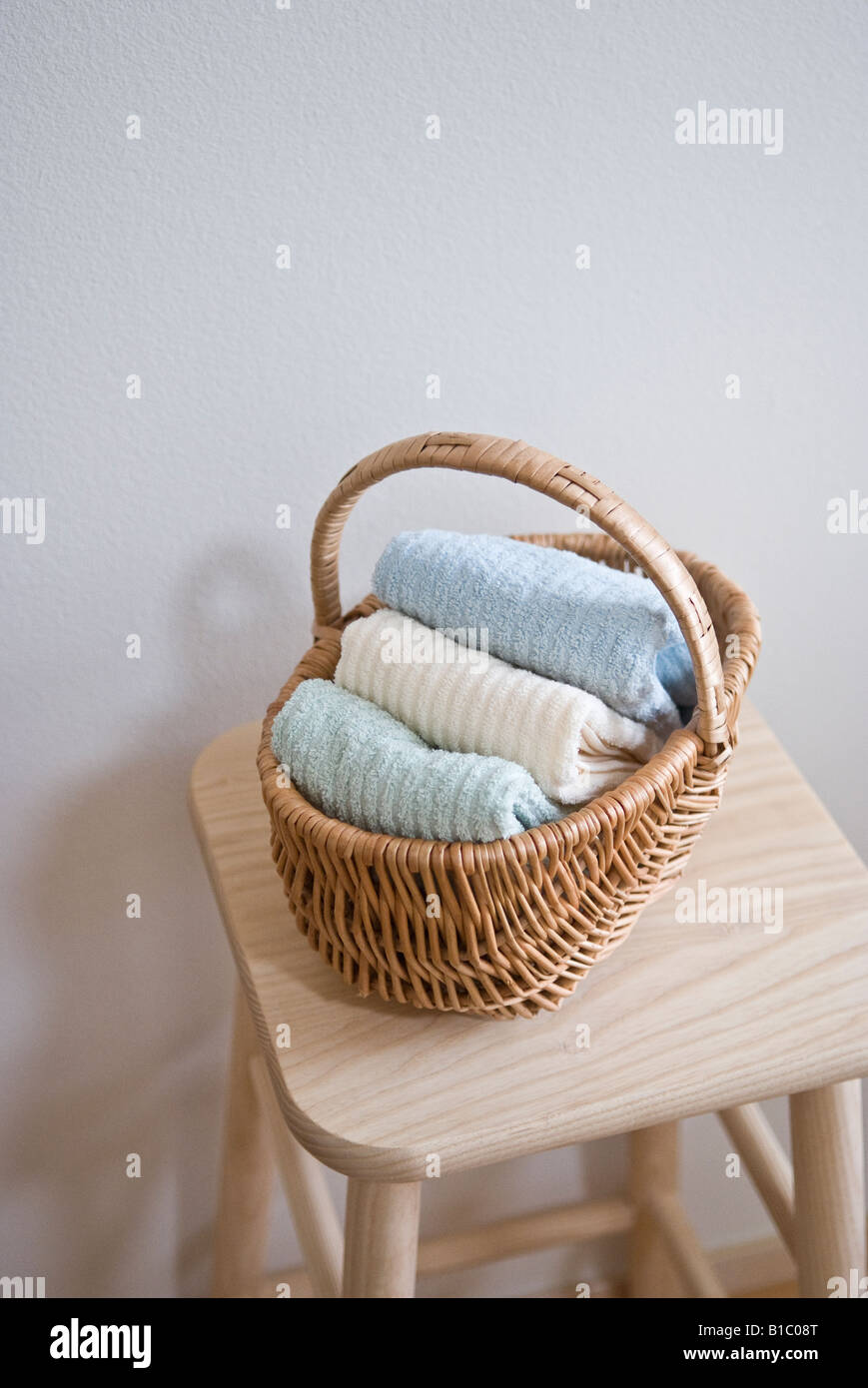 Towels in basket Stock Photo - Alamy