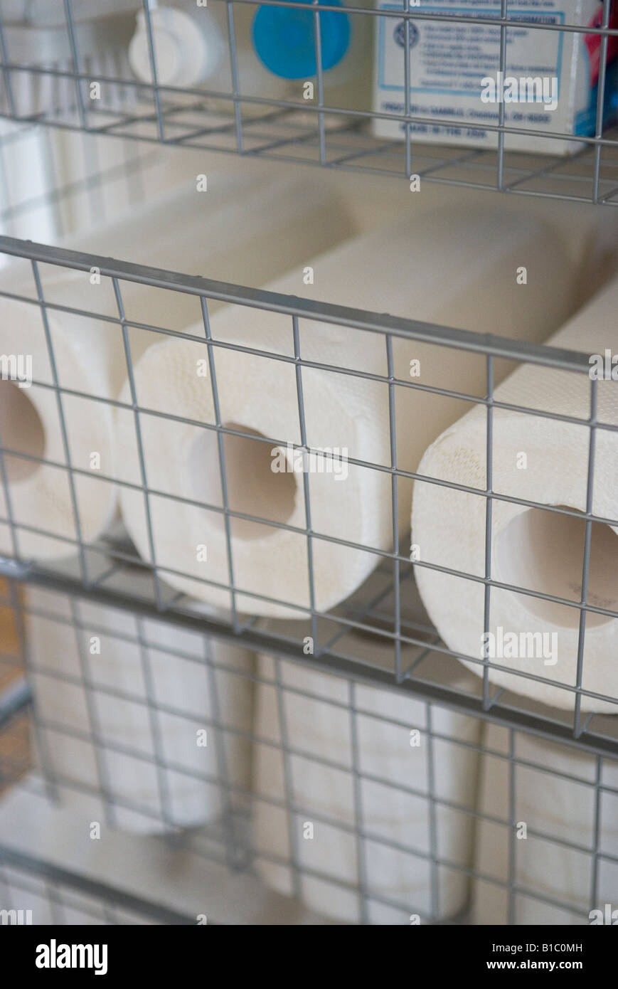 Toilet papers in wire rack Stock Photo - Alamy