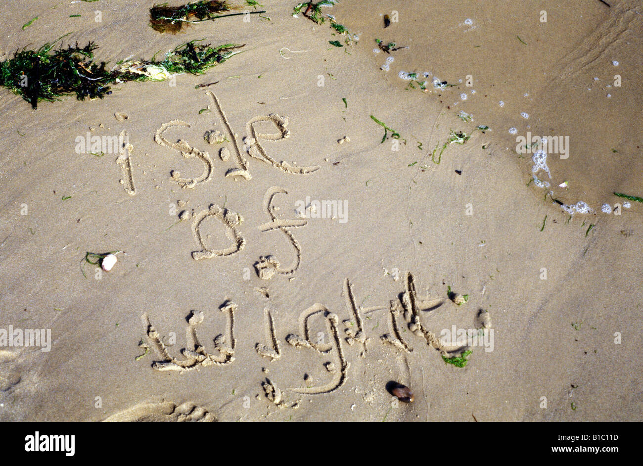 Isle of Wight written into the sand on the beach Stock Photo - Alamy