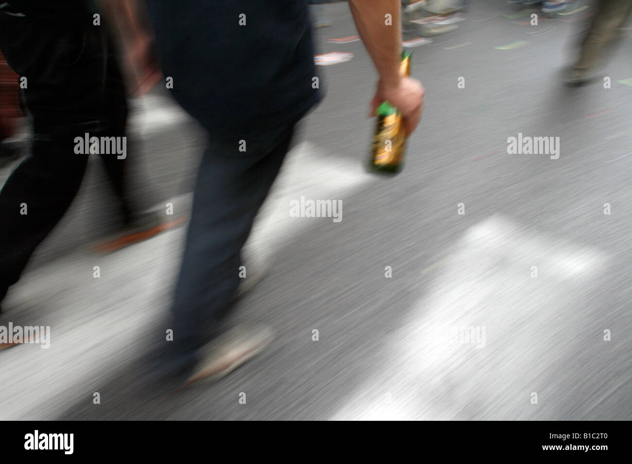 man carrying beer bottle in town Stock Photo - Alamy