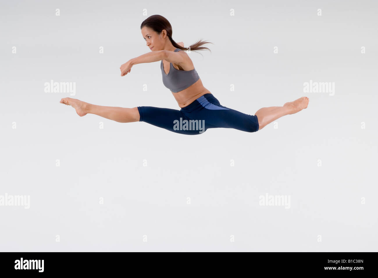 Young woman jumping Stock Photo - Alamy