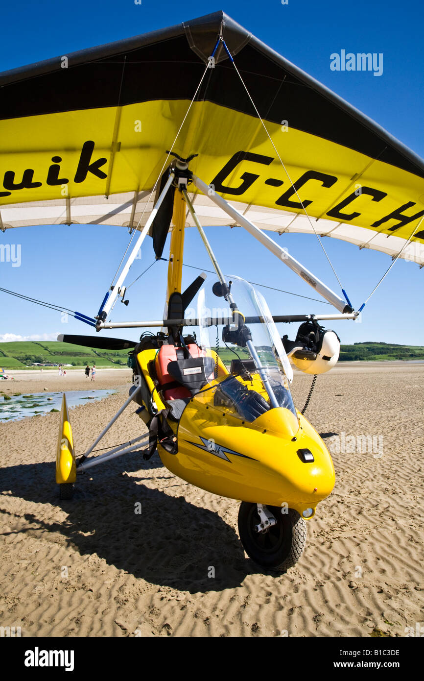 A yellow Quik microlight aircraft on the beach at Ettrick Bay, Isle of ...