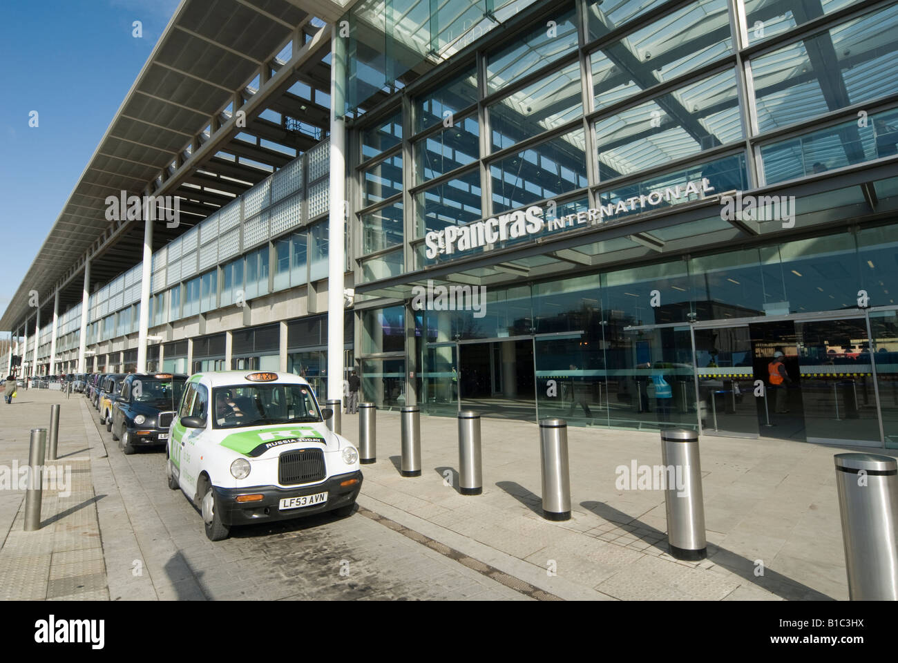 Taxis queue at the taxi rank outside St Pancras International station ...