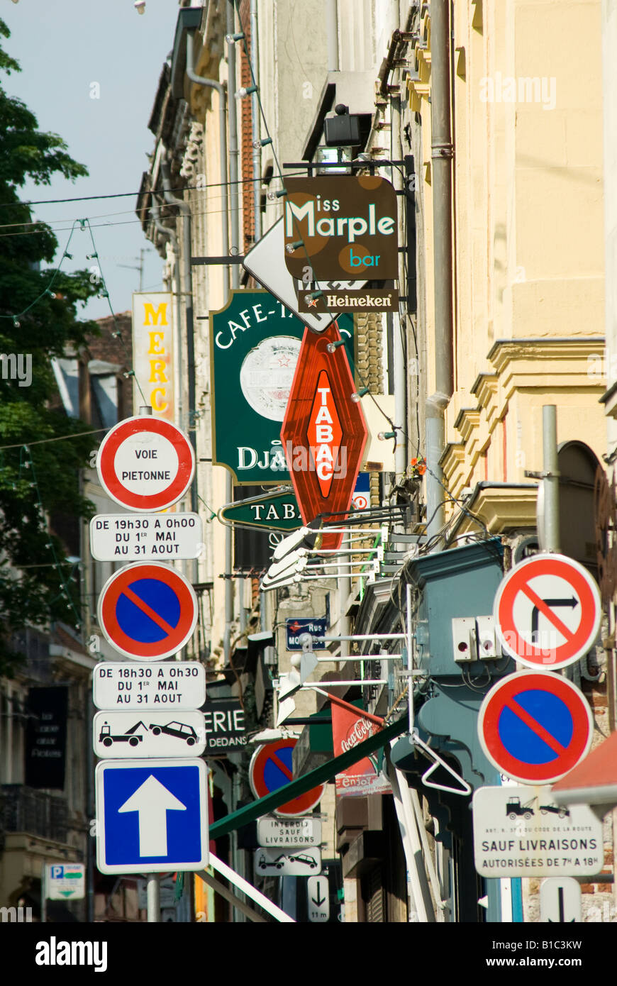 Cluster of road signs on a French street in France Stock Photo - Alamy
