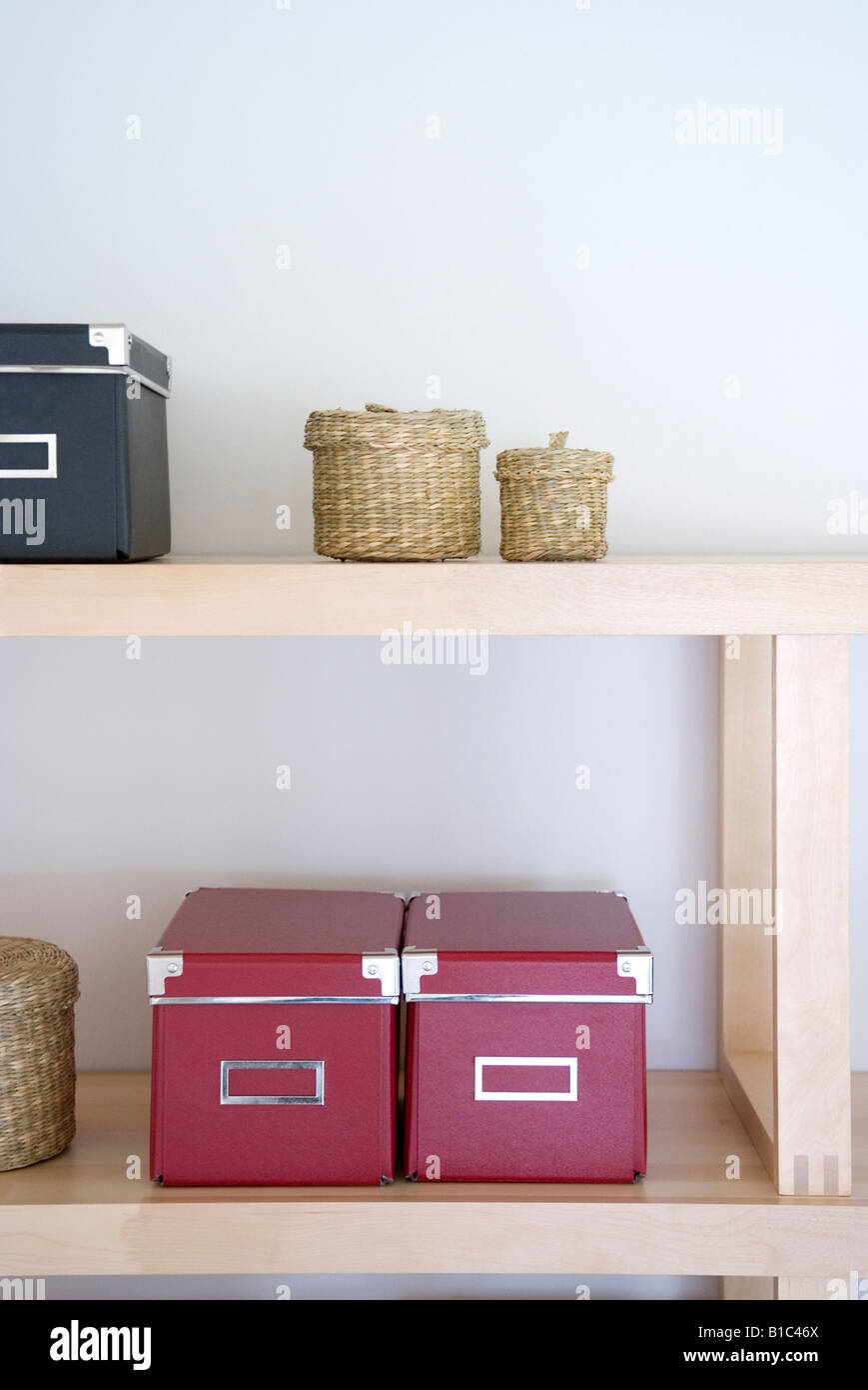 Baskets and boxes on shelf Stock Photo - Alamy