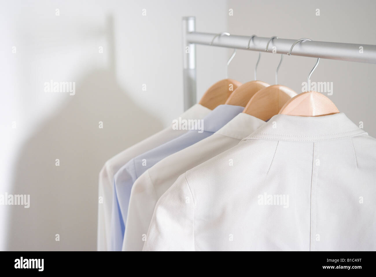 Shirts on hangers Stock Photo - Alamy