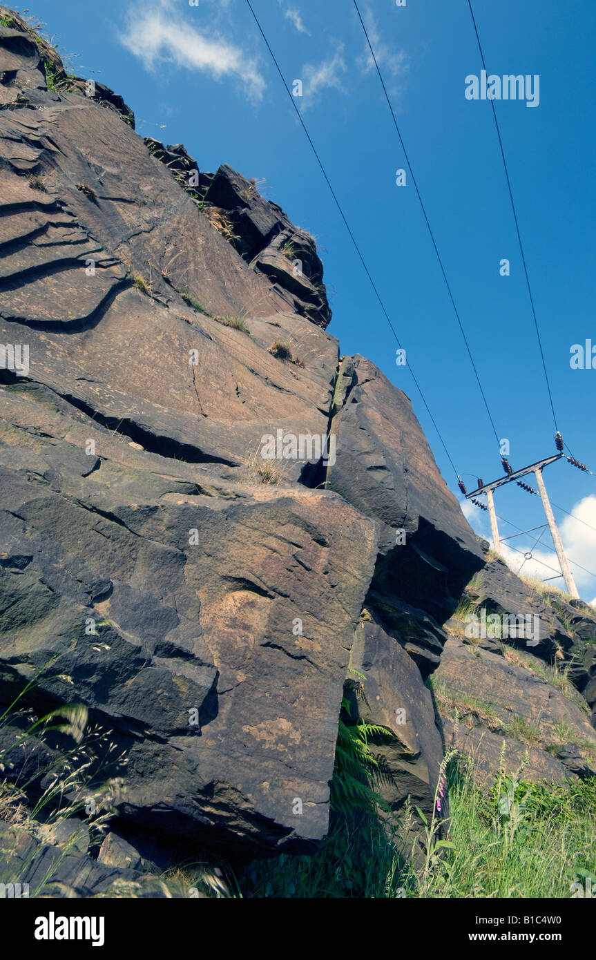 Power lines running across rocks and gritstone edge at" Hunshelf Bank ...