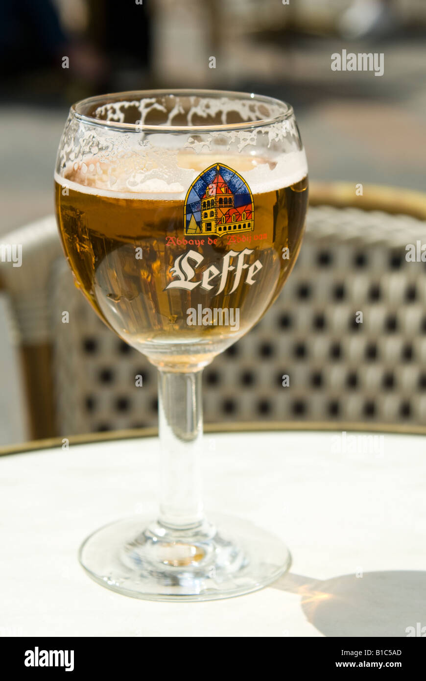 Glassof beer on a table outside a street cafe in the french town of ...