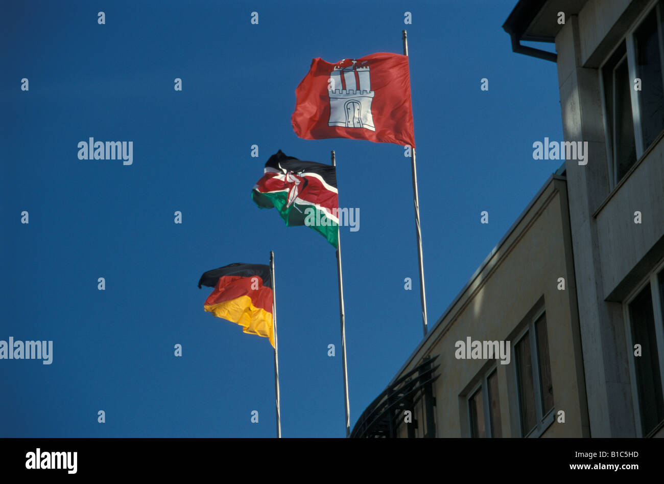 Flags of Germany, Kenya and Hamburg on an building in Hamburg, Germany ...