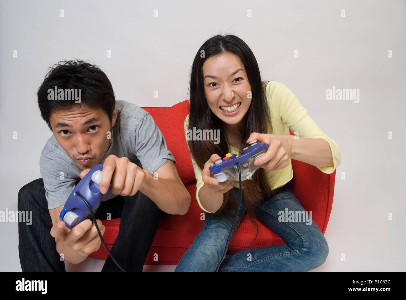 Two people playing video game Stock Photo - Alamy