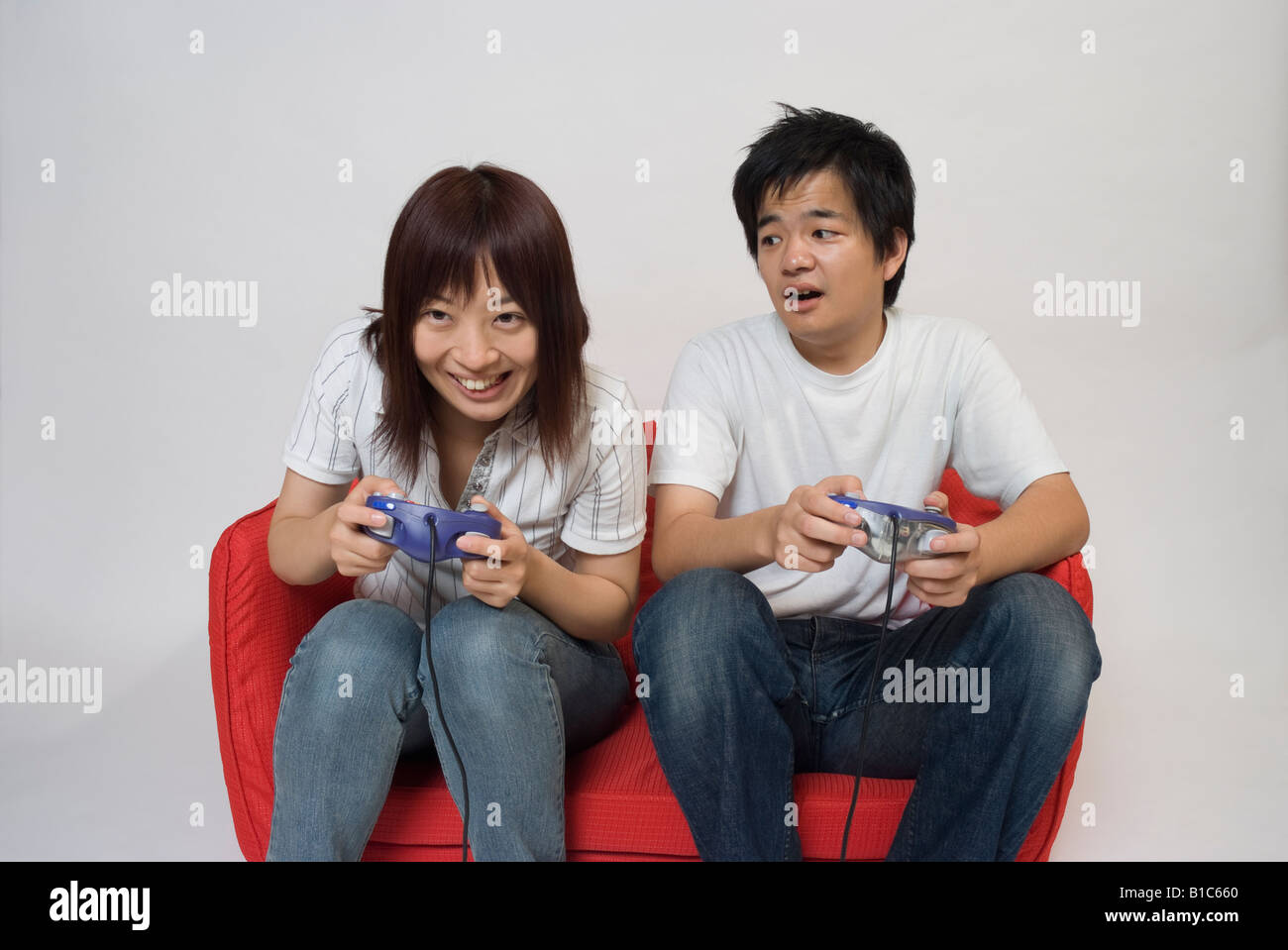Two people playing video game Stock Photo - Alamy