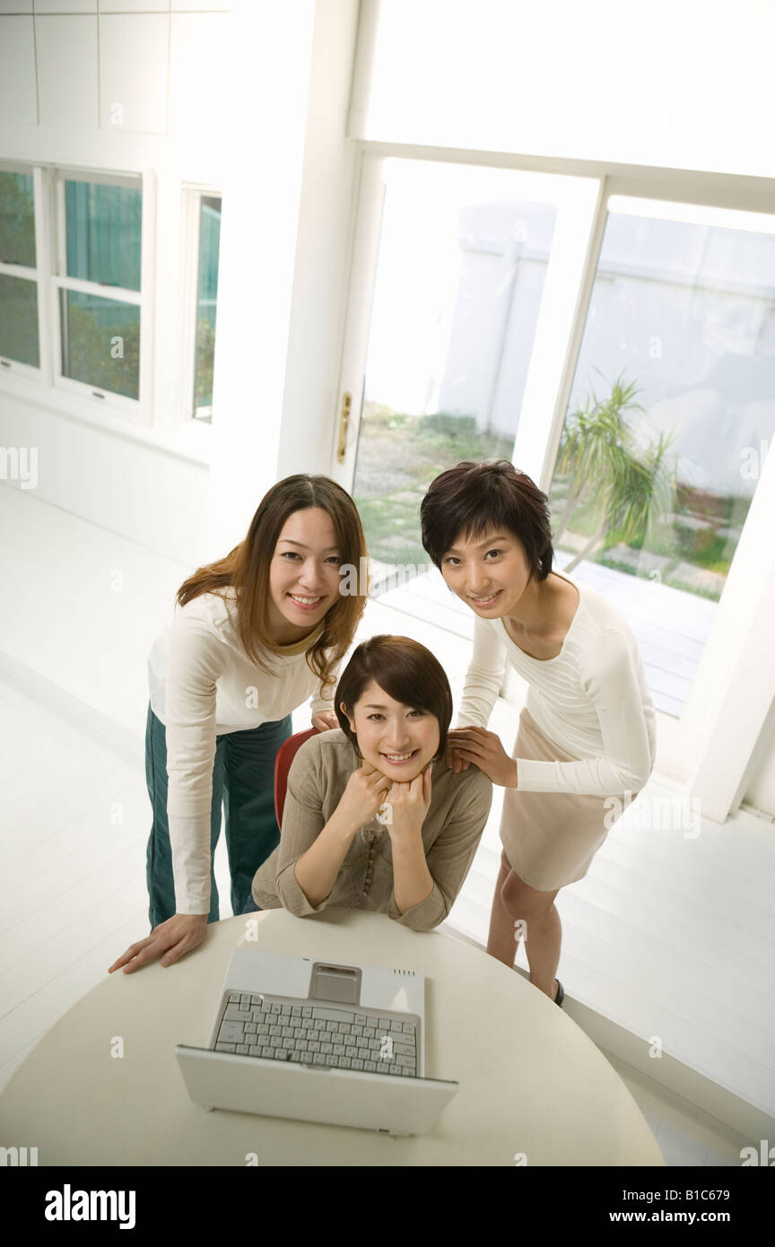 Young women using computer Stock Photo - Alamy