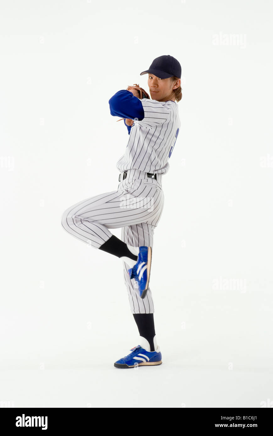 Pitcher preparing to throw a ball Stock Photo - Alamy