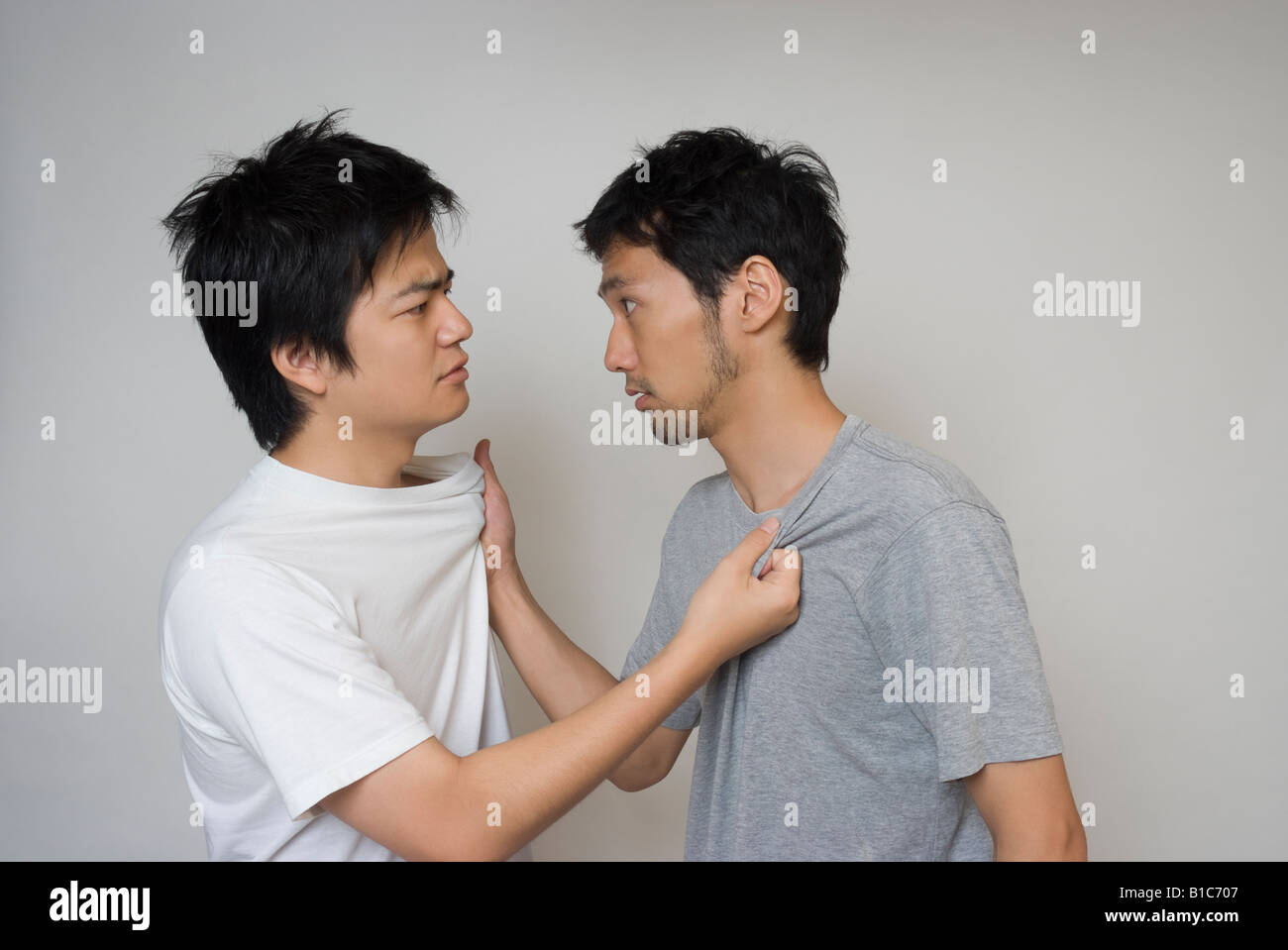 Two young men fighting Stock Photo - Alamy