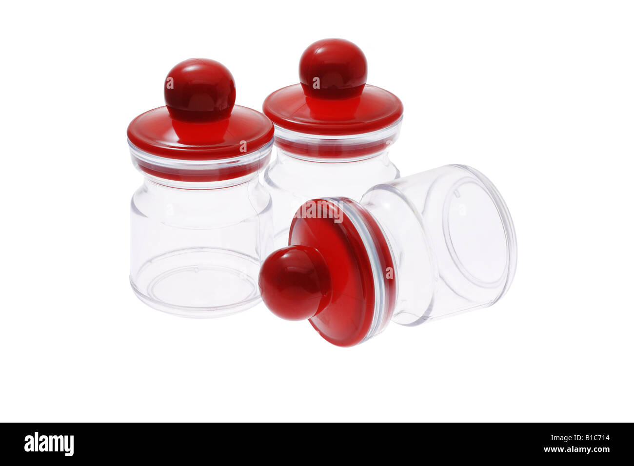 Three empty plastic condiment containers isolated on white Stock Photo ...