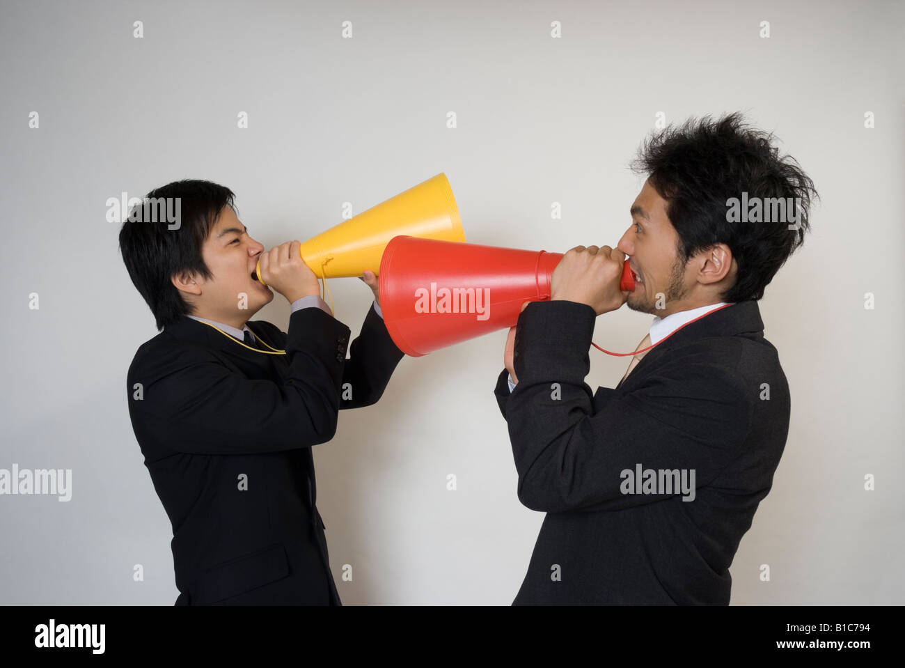 Two businessmen shouting Stock Photo - Alamy
