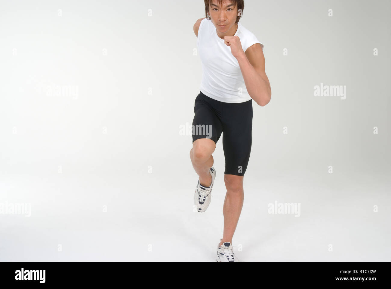 Young man running Stock Photo - Alamy