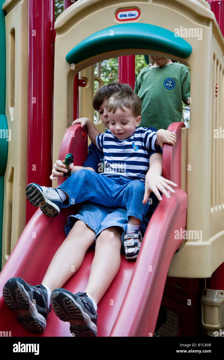 Male children playing on playground equipment at Silver River State ...