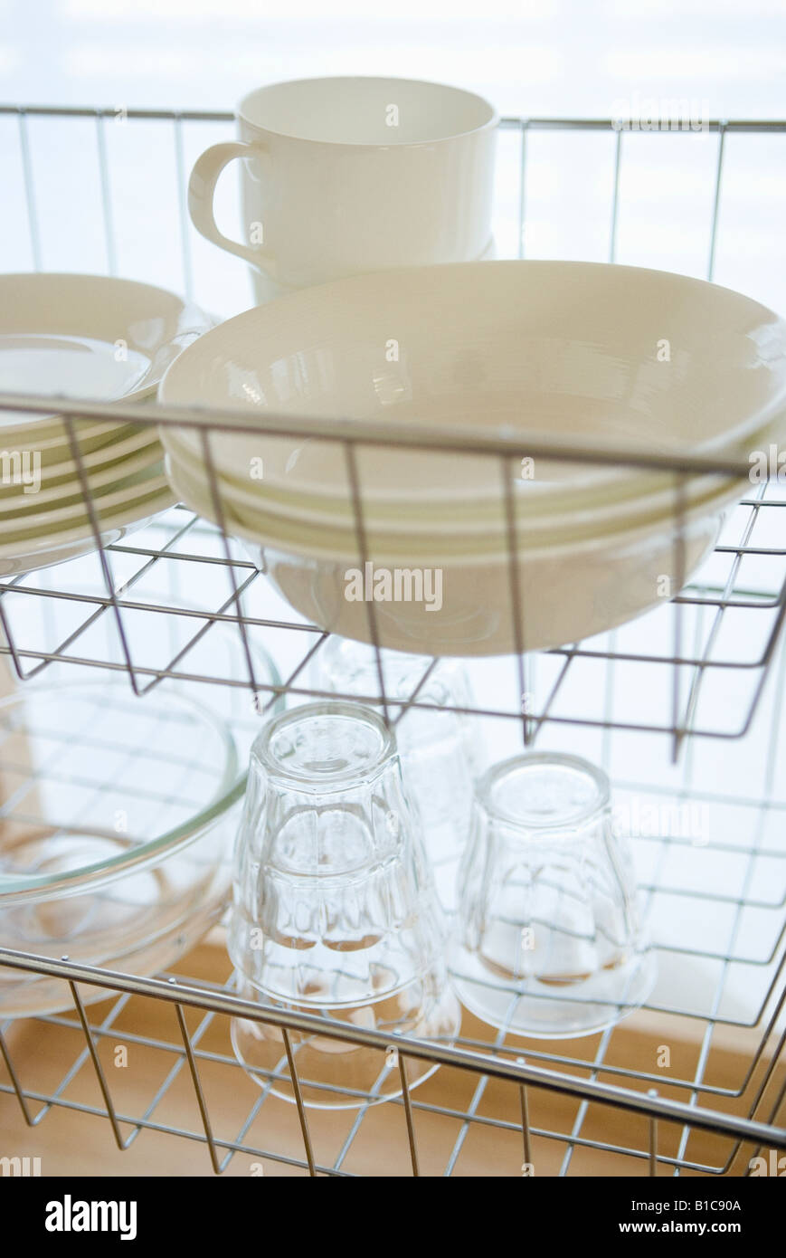 Tableware in rack Stock Photo - Alamy
