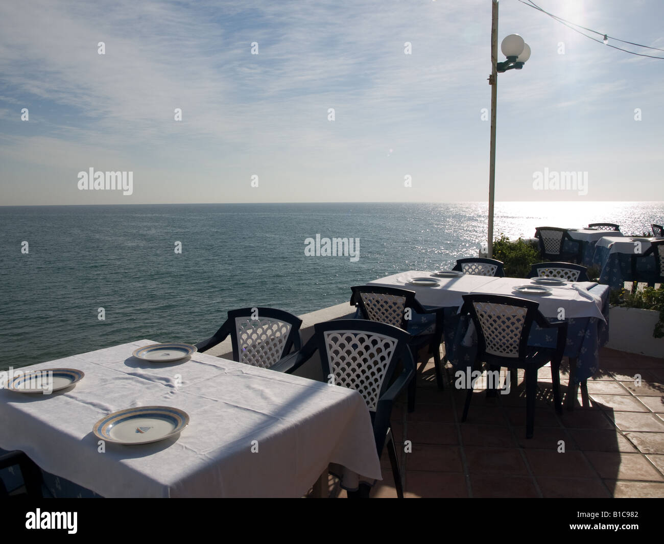 Restaurant table settings outdoor with sea in background Stock Photo ...
