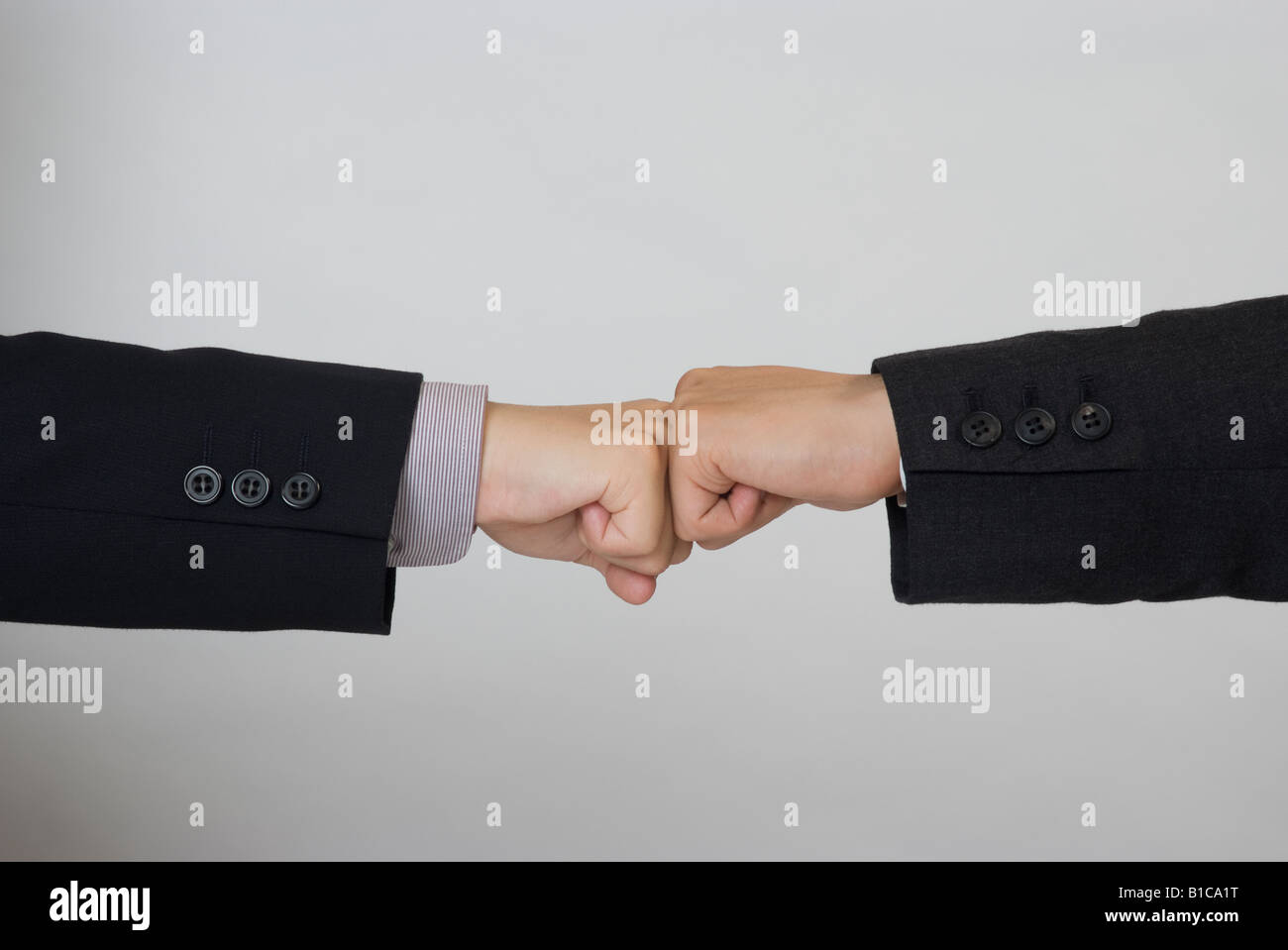 Two hands touching knuckles together Stock Photo - Alamy