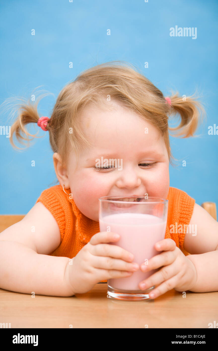 Little girl eating baby food Stock Photo - Alamy
