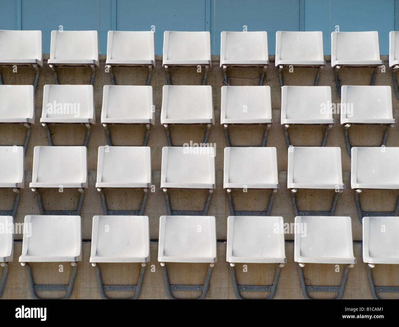 Group of aligned empty white sits Stock Photo - Alamy