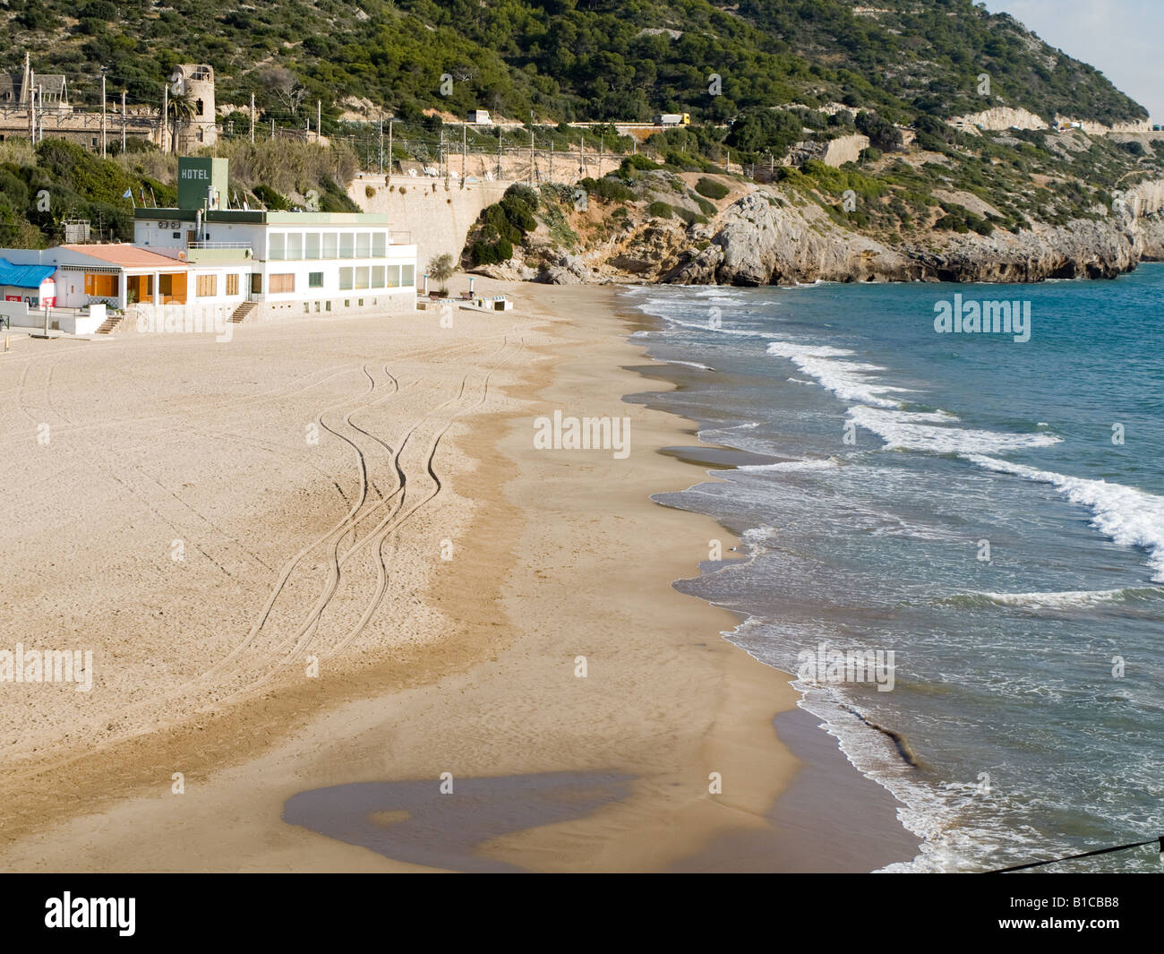Empty beach with rocks in background in the sunny afternoon. Spain ...