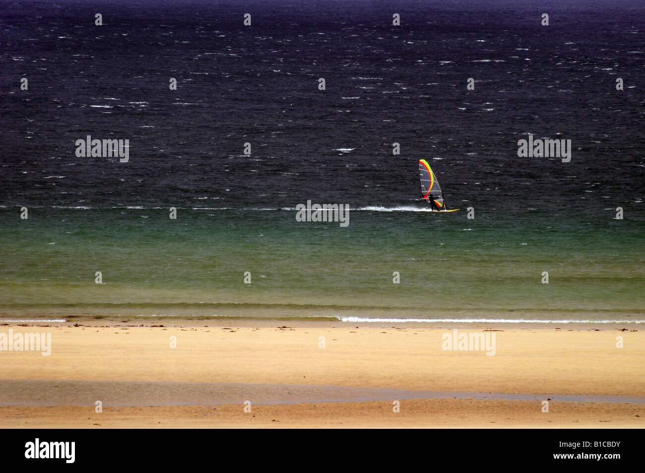 A windsurfer off Hayle Beach in Cornwall UK Stock Photo - Alamy