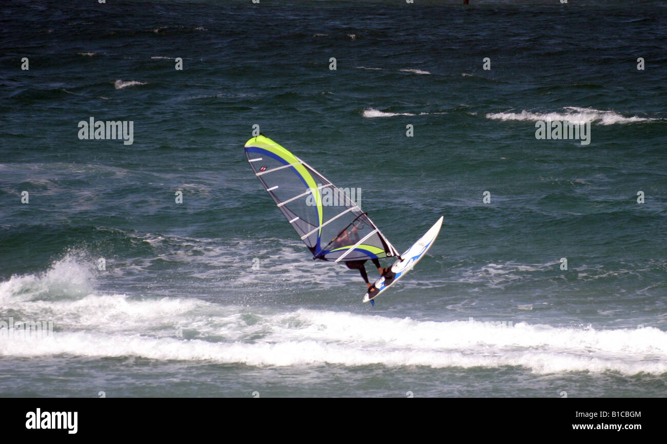 A windsurfer off Hayle Beach in Cornwall UK Stock Photo - Alamy