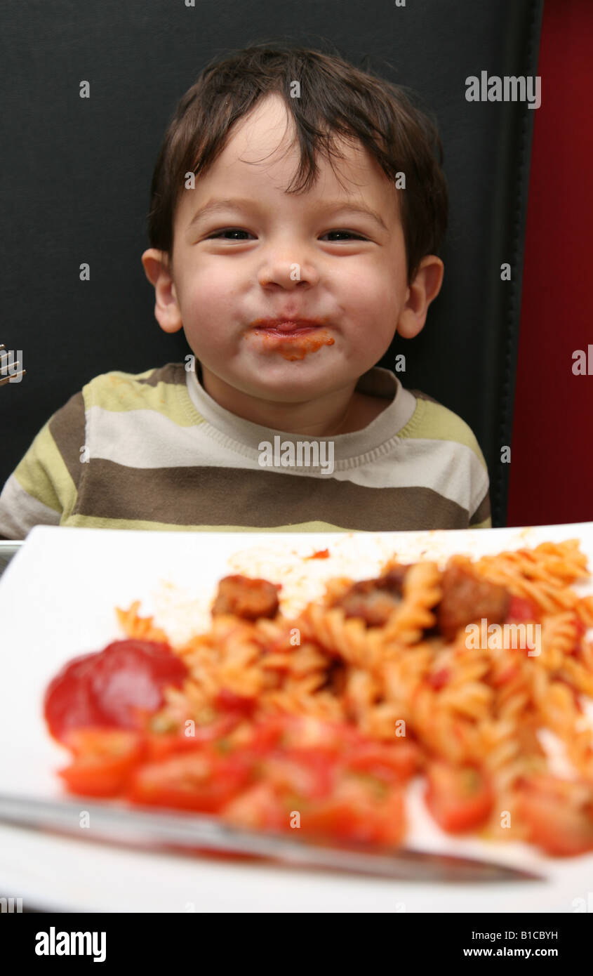 Messy child being fussy at mealtimes Stock Photo - Alamy