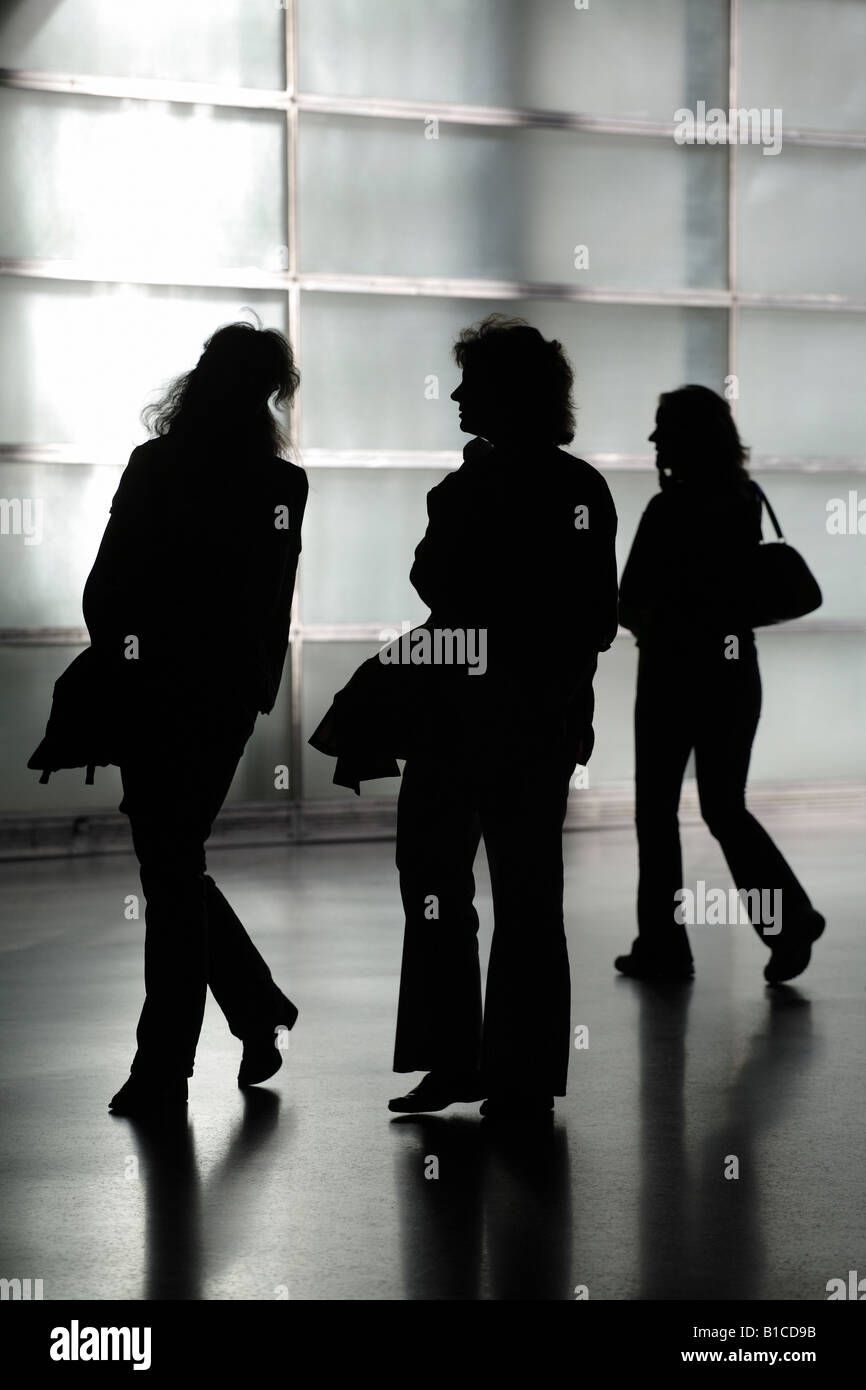 Silhouettes of three women Stock Photo - Alamy