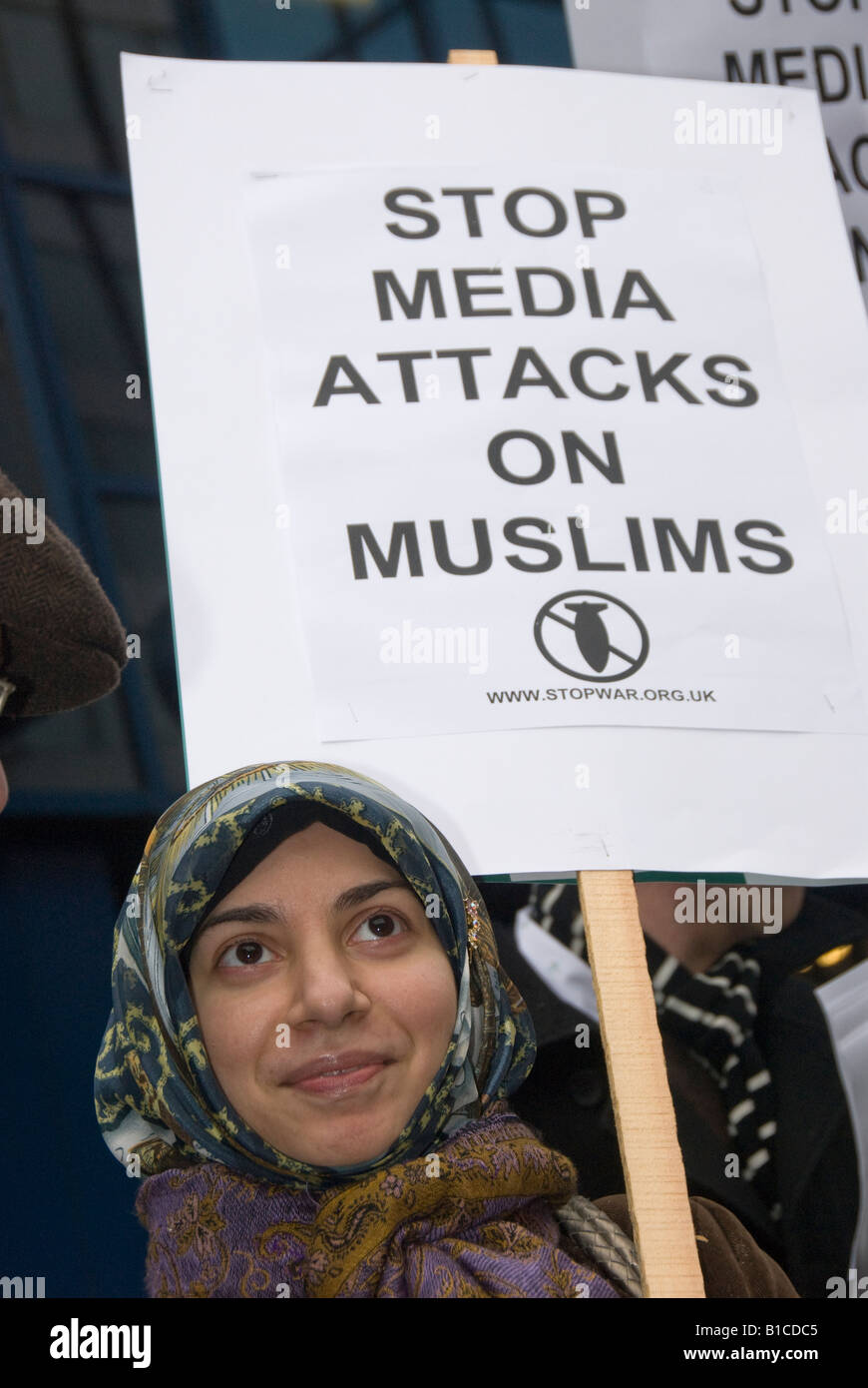 Muslim woman with 'Stop Media Attacks on Muslims' placard outside the ...