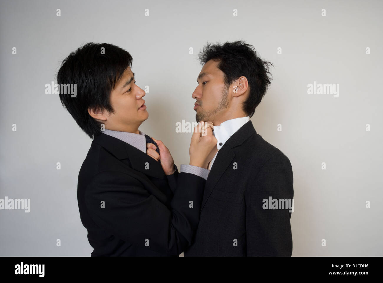 Two businessmen fighting Stock Photo - Alamy
