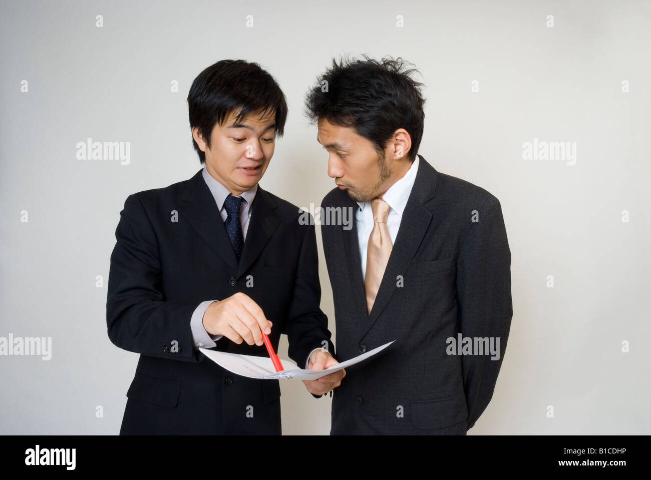 Businessman pointing out mistakes Stock Photo - Alamy
