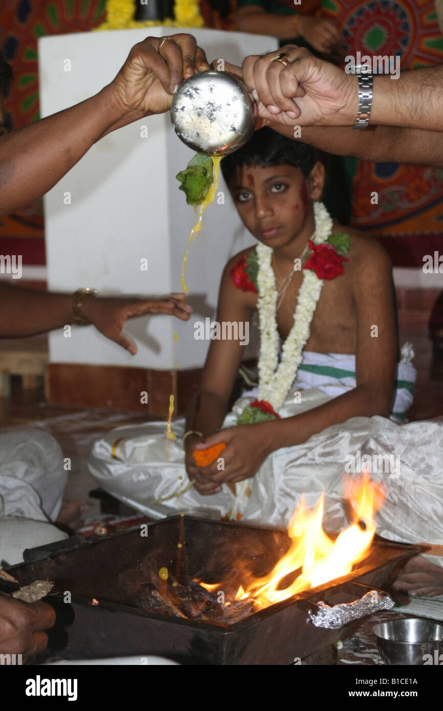 Priest and father perform havan - a sacred purifying ritual ( yajna ...
