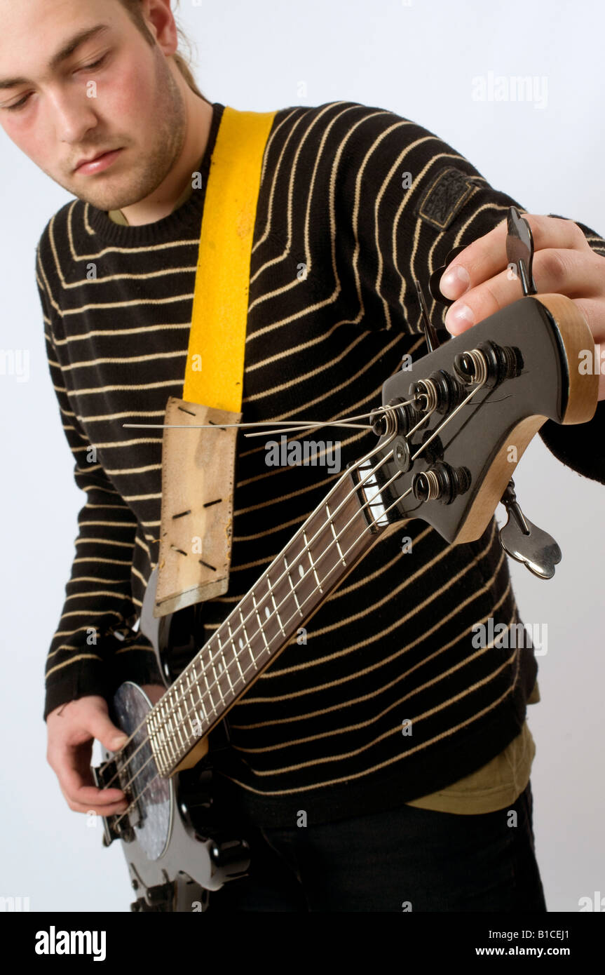 Man playing electric guitar on white background Stock Photo - Alamy