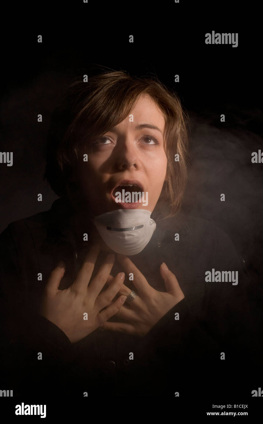 Woman in medical mask inside clouds of smoke Stock Photo - Alamy