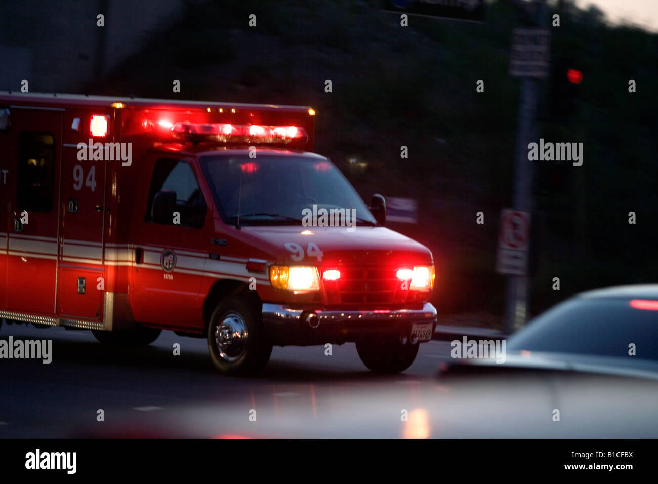 An ambulance rushes through a busy intersection in Los Angeles ...