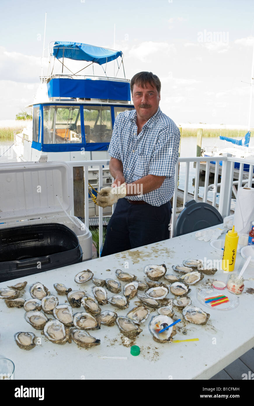 Captain Tony Sadler shucks fresh oysters from Apalachicola Bay ...