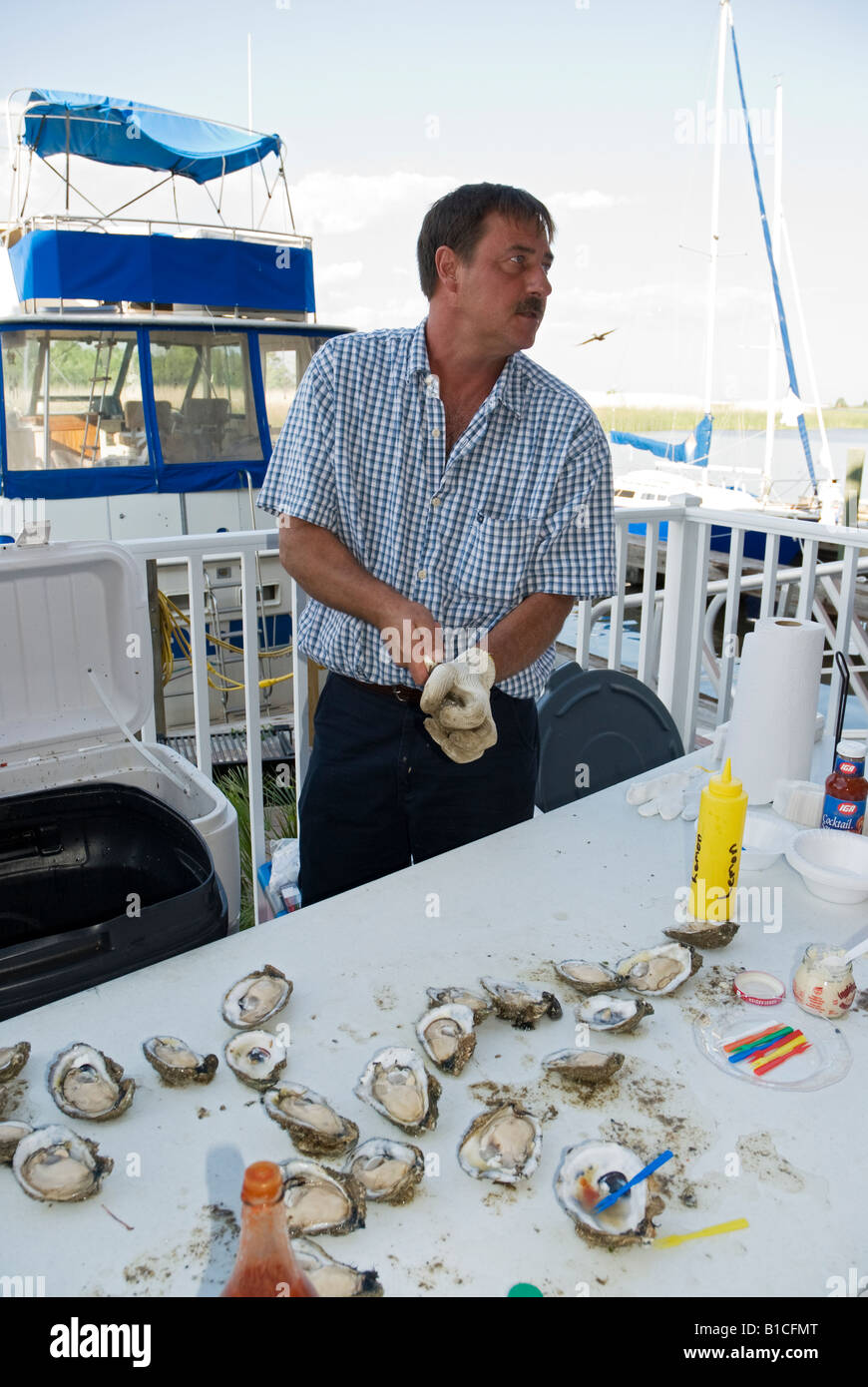Captain Tony Sadler shucks fresh oysters from Apalachicola Bay ...