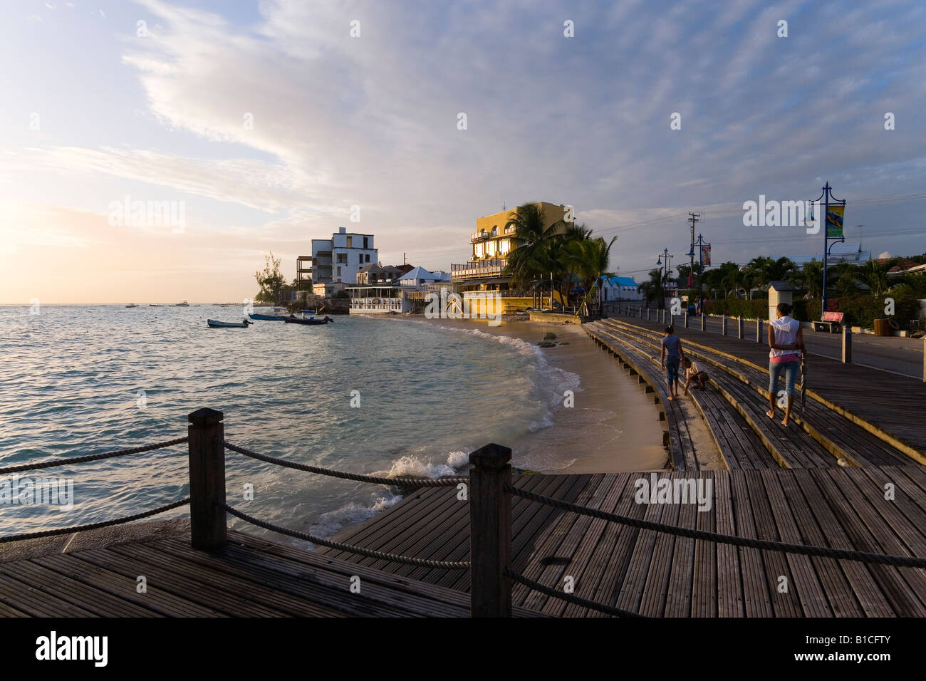 View along promenade St Lawrence Gap Barbados Caribbean Stock Photo - Alamy