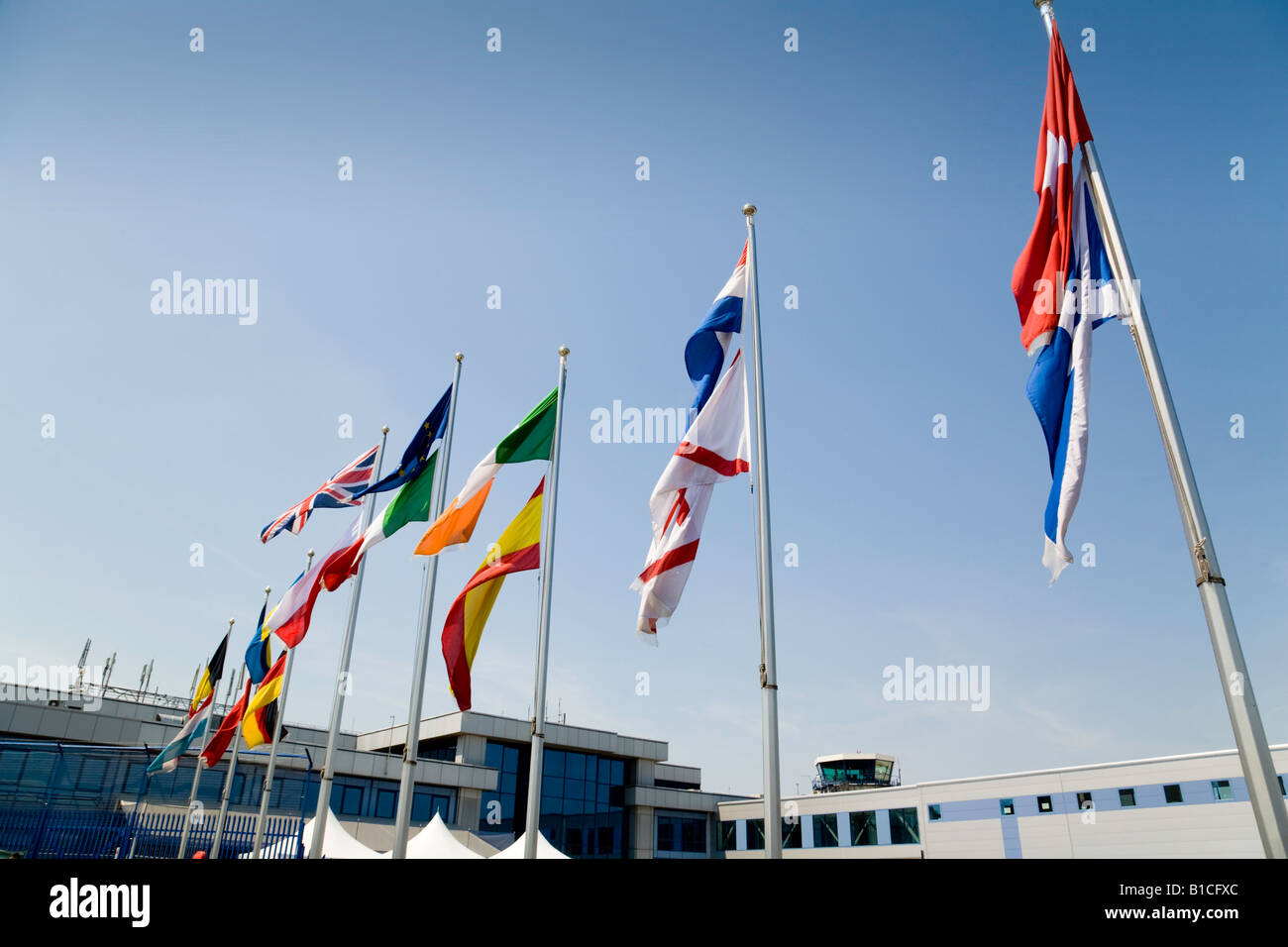Colourful European flags fly outside London City Airport, London ...